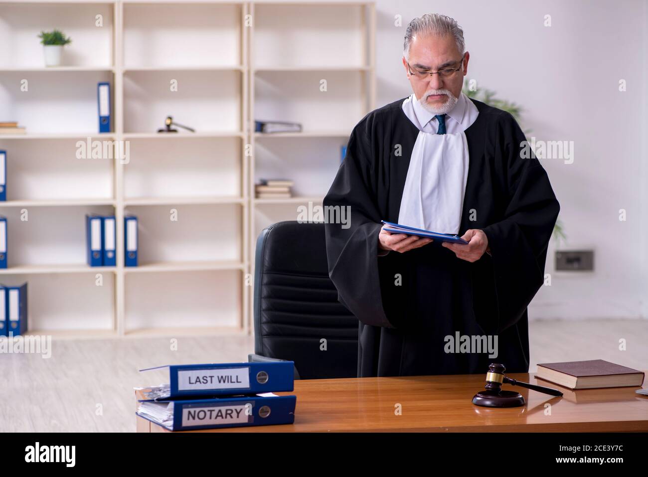 Old judge working in courthouse Stock Photo - Alamy
