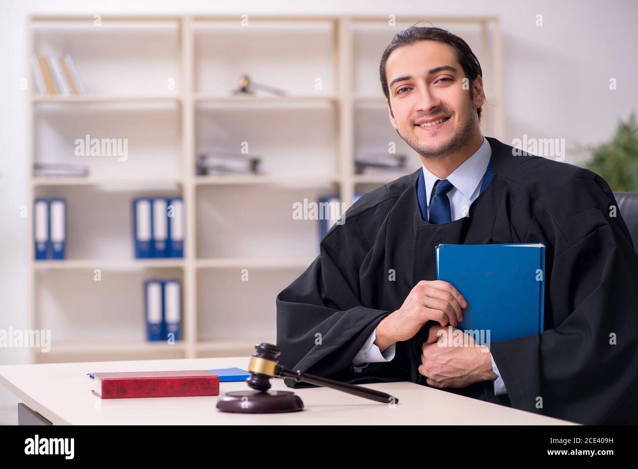 Young judge working in courthouse Stock Photo - Alamy