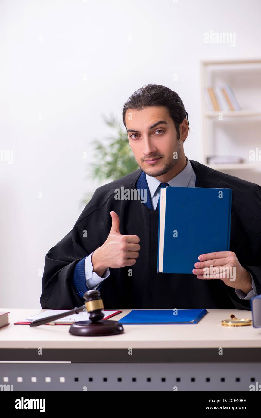 Young judge working in courthouse Stock Photo - Alamy