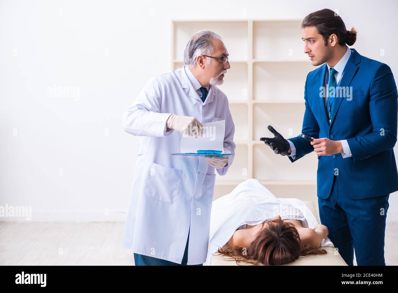 Police coroner examining dead body corpse in the morgue Stock Photo - Alamy