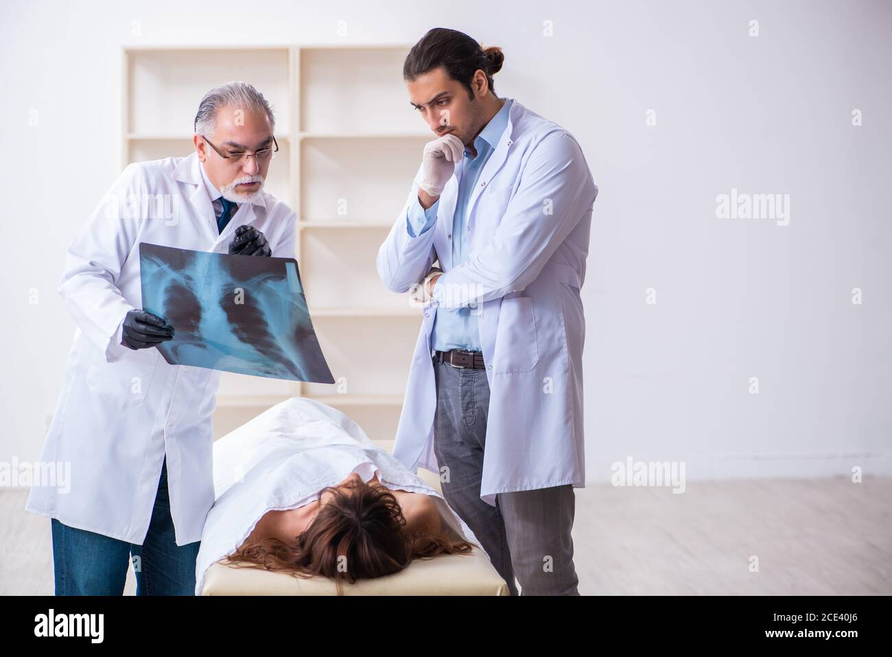 Police coroner examining dead body corpse in the morgue Stock Photo - Alamy