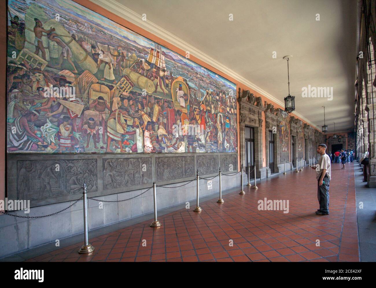 Man viewing Diego Rivera mural in the National Palace, Mexico City ...