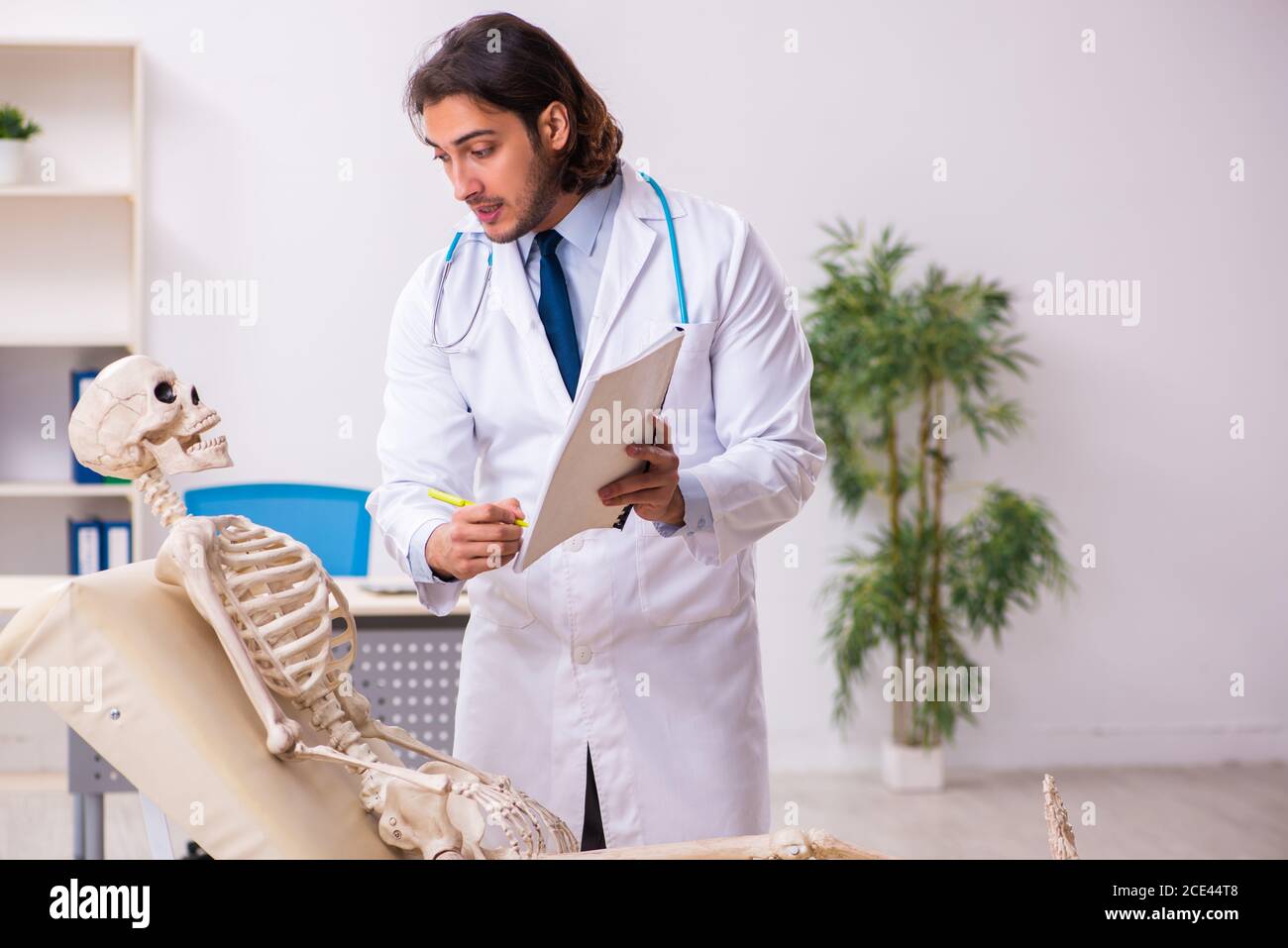 Crazy doctor examining the dead patient Stock Photo - Alamy