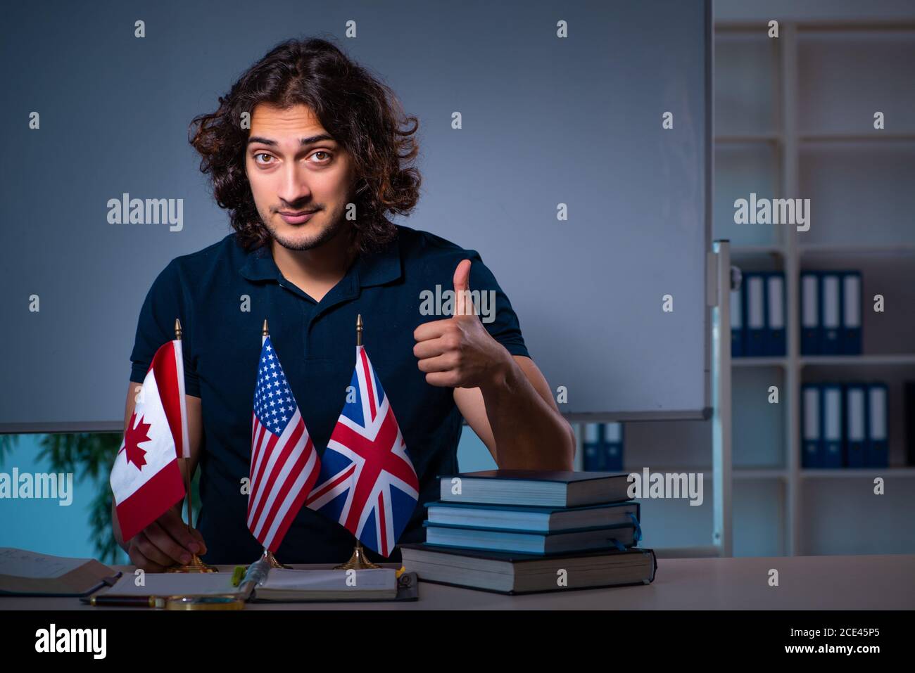 Young student in the classroom at night Stock Photo - Alamy