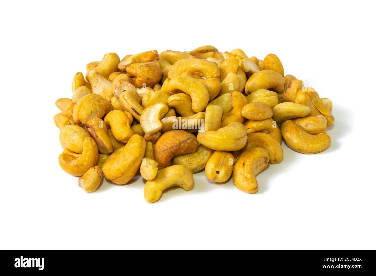 Roasted cashew nuts isolated on white background. Front views, close-up ...