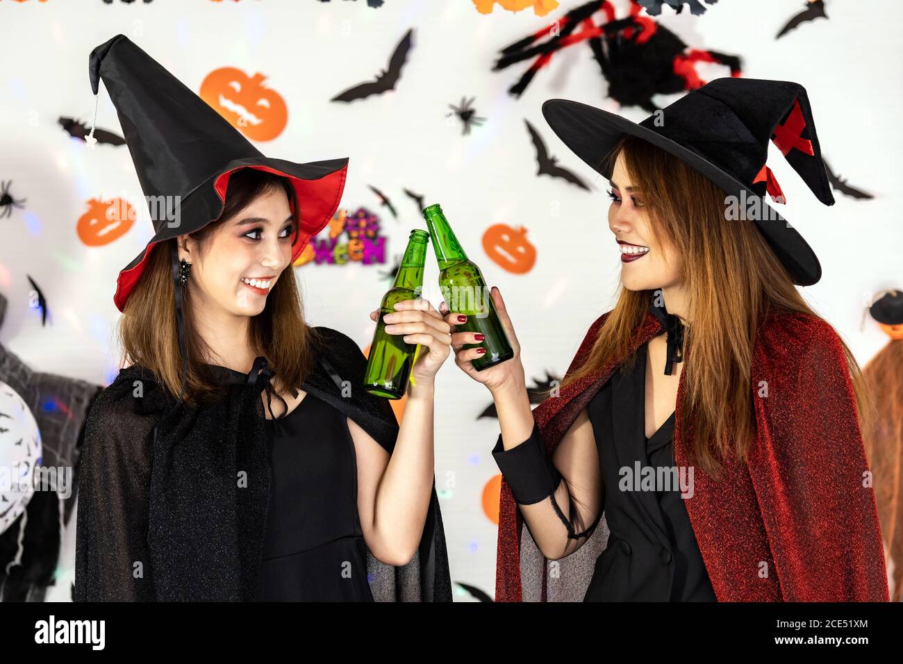 Asian women celebrate cheers in Halloween party Stock Photo - Alamy