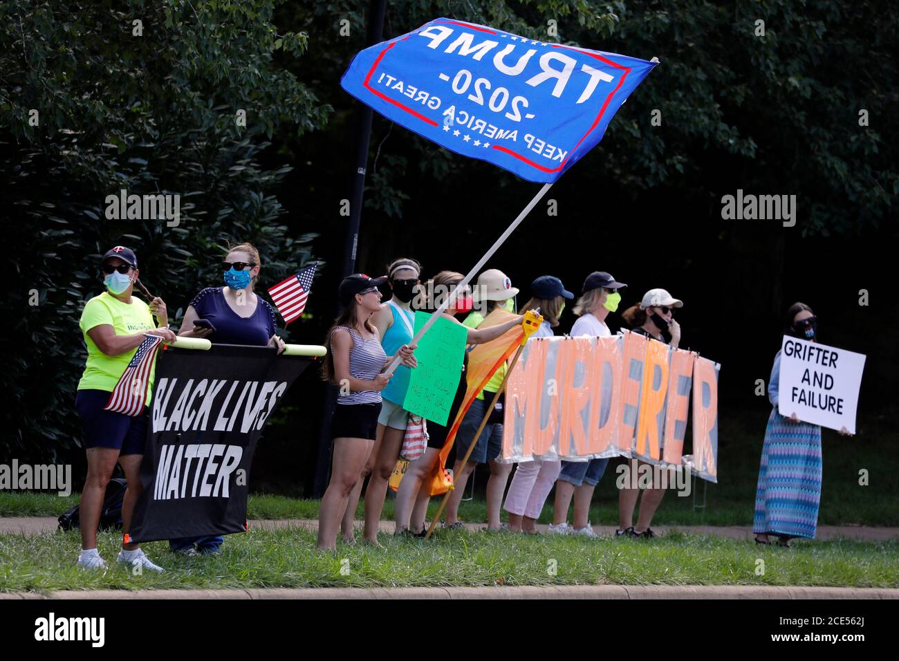 Protesters and supporters gather outside Trump National Golf Club in ...