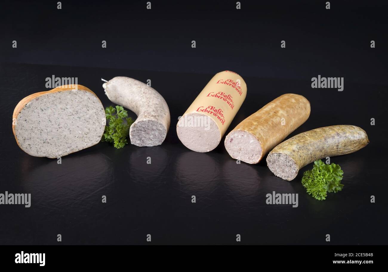 Traditional German meat paste offered as closeup on a black board with ...