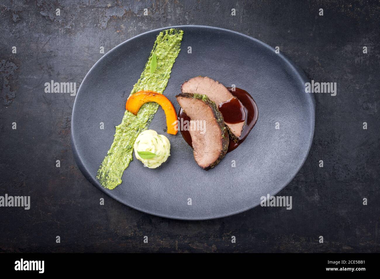 Traditional roasted beef heart with fried pumpkin slices Stock Photo ...