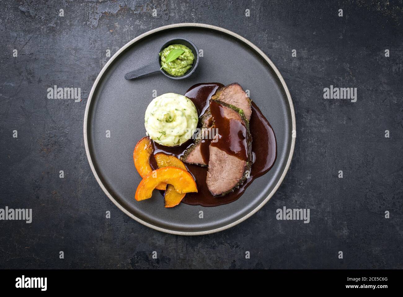 Traditional roasted beef heart with fried pumpkin slices Stock Photo ...