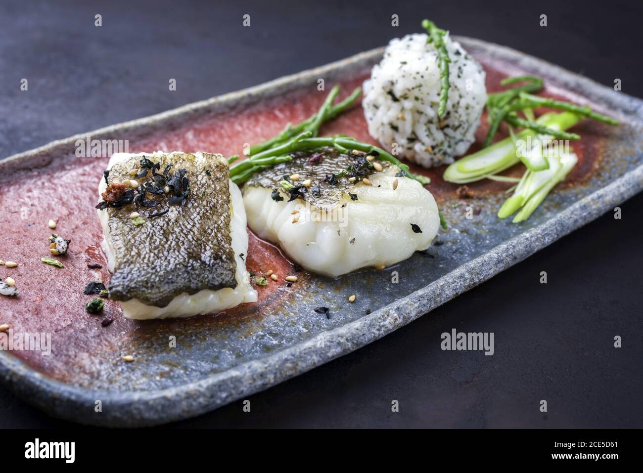 Gourmet fried Japanese skrei cod fish filet with glasswort and furikake ...