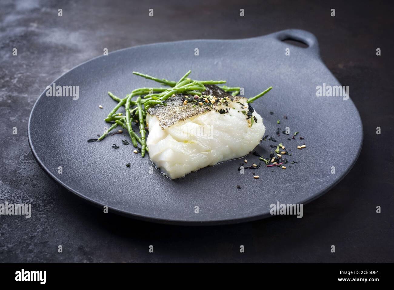 Gourmet fried Japanese skrei cod fish filet with glasswort and furikake ...