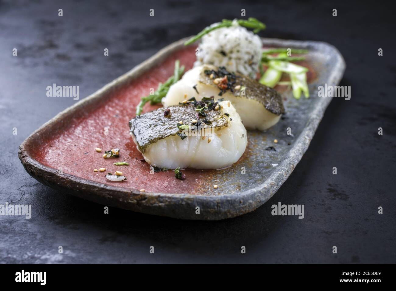 Gourmet fried Japanese skrei cod fish filet with glasswort and furikake ...