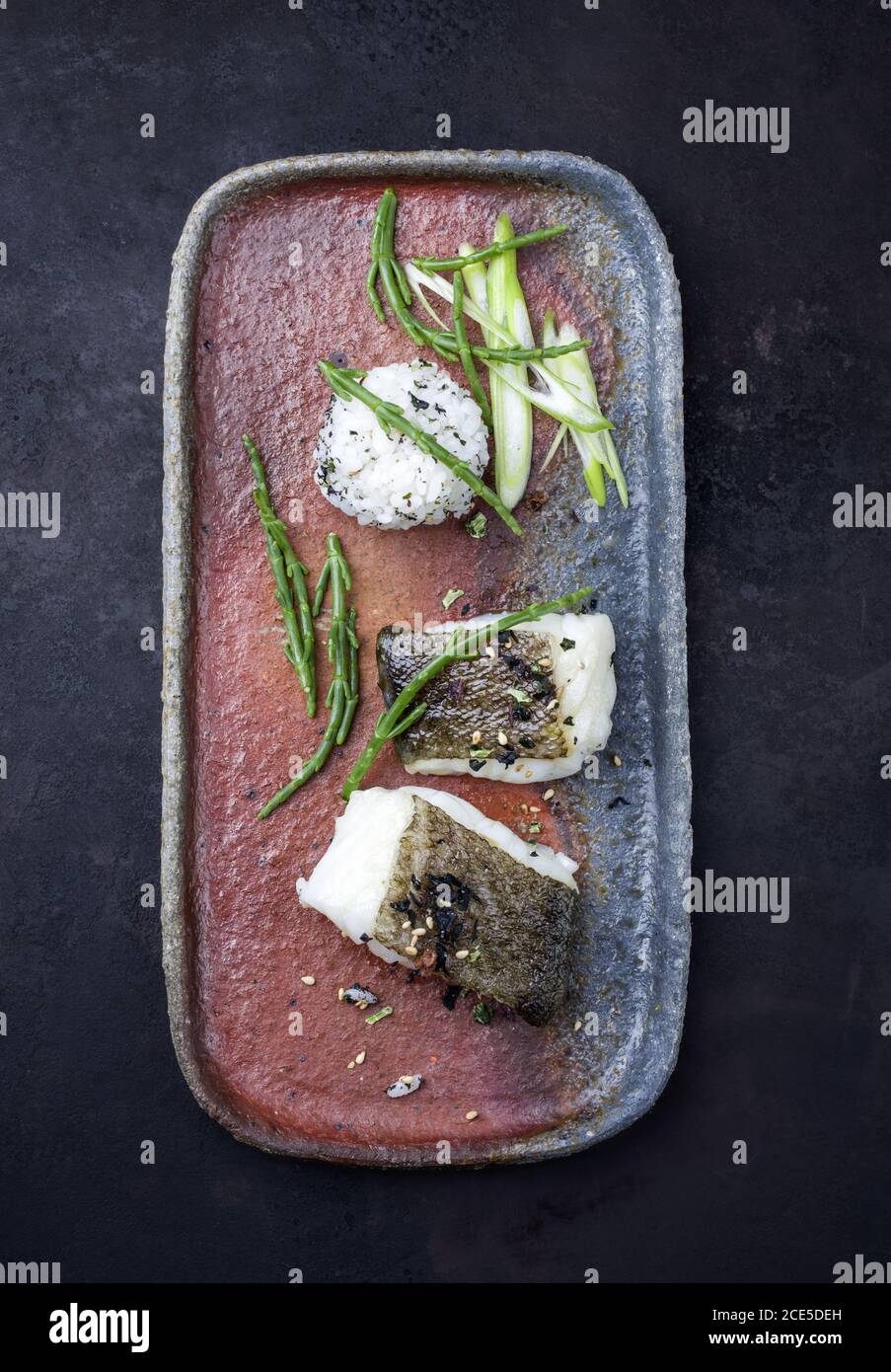 Gourmet fried Japanese skrei cod fish filet with glasswort and furikake ...