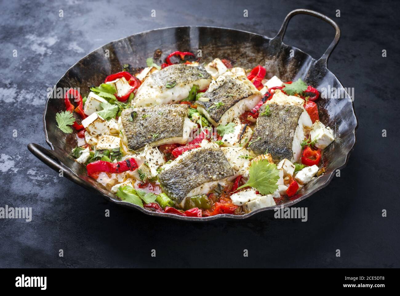 Traditional fried Greek cod fish filet casserole with feta cheese and ...