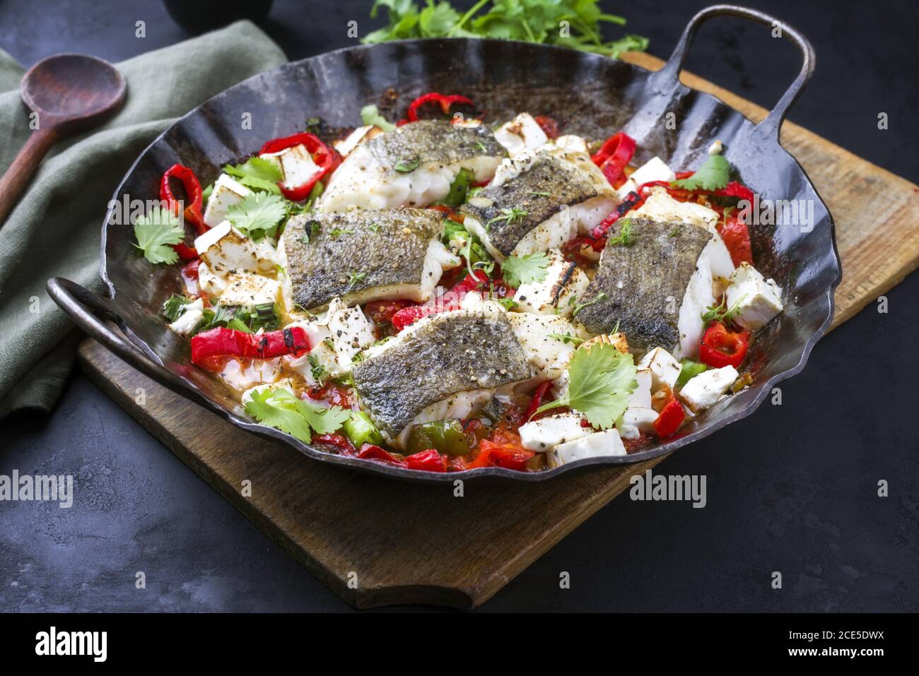 Traditional fried Greek cod fish filet casserole with feta cheese and ...