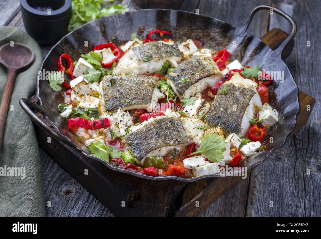 Traditional fried Greek cod fish filet casserole with feta cheese and ...