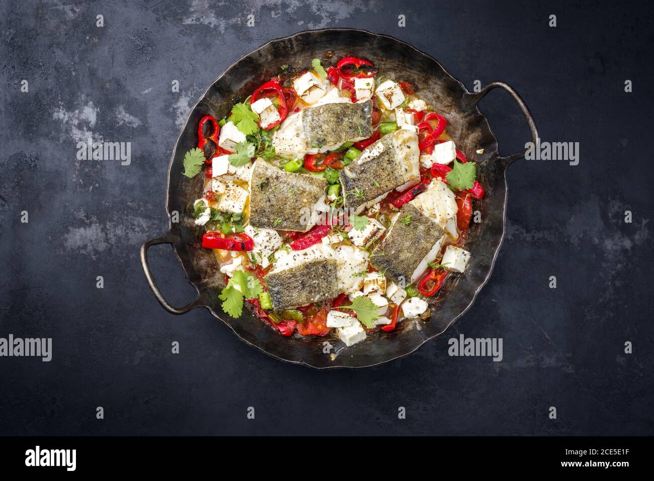 Traditional fried Greek cod fish filet casserole with feta cheese and ...