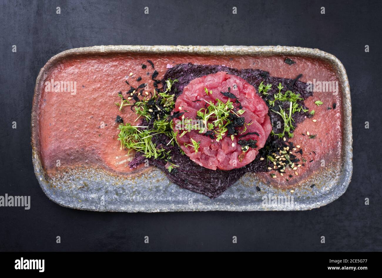 Gourmet fish tartar raw from tuna fillet with hashed avocado Stock ...
