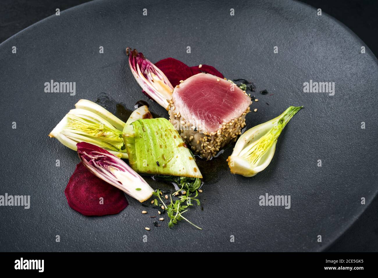 Japanese gourmet fried tuna fish steak tataki with pak choi Stock Photo ...