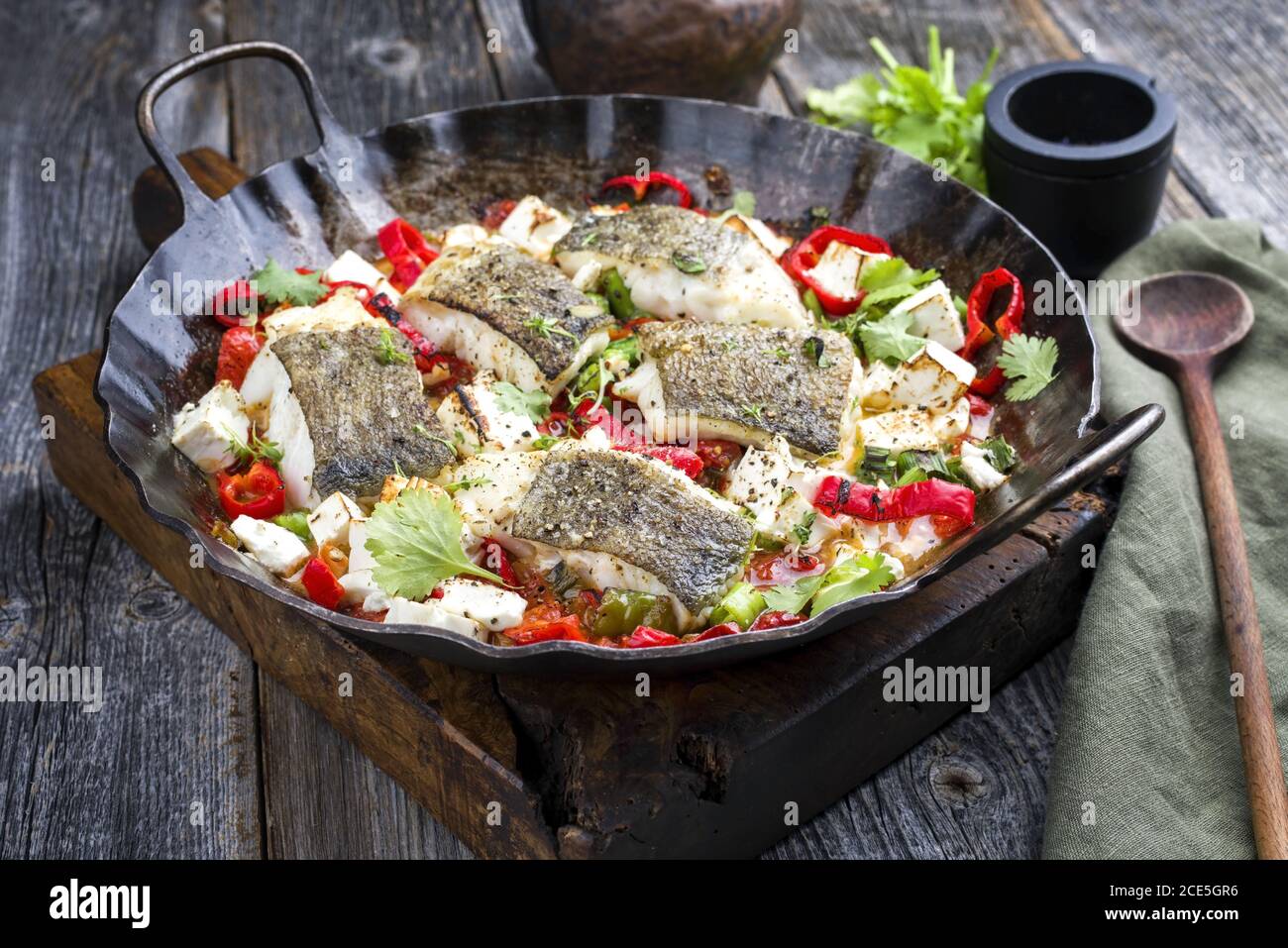 Traditional fried Greek cod fish filet casserole with feta cheese and ...