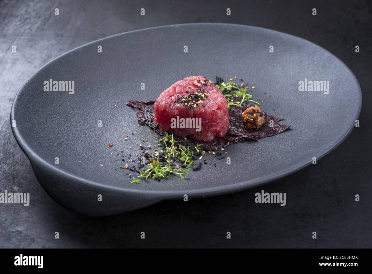Gourmet fish tartar raw from tuna fillet with seaweed Stock Photo - Alamy