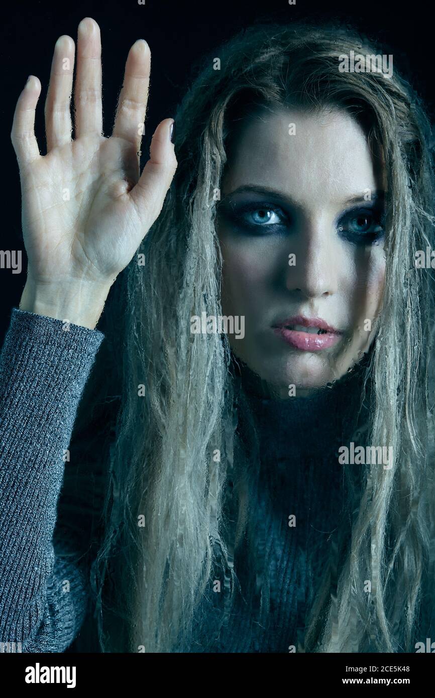 Woman behind window drops hi-res stock photography and images - Alamy