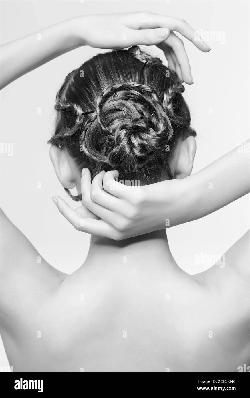 Black and white portrait in high key tone female with creative hairdo ...