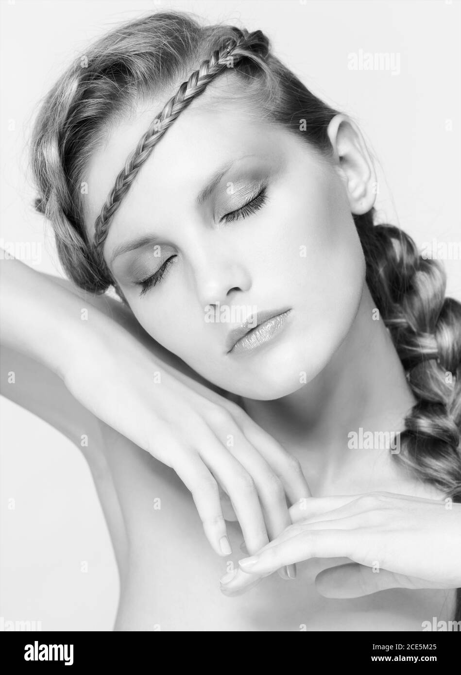 Black and white portrait in high key tone female with creative hairdo ...