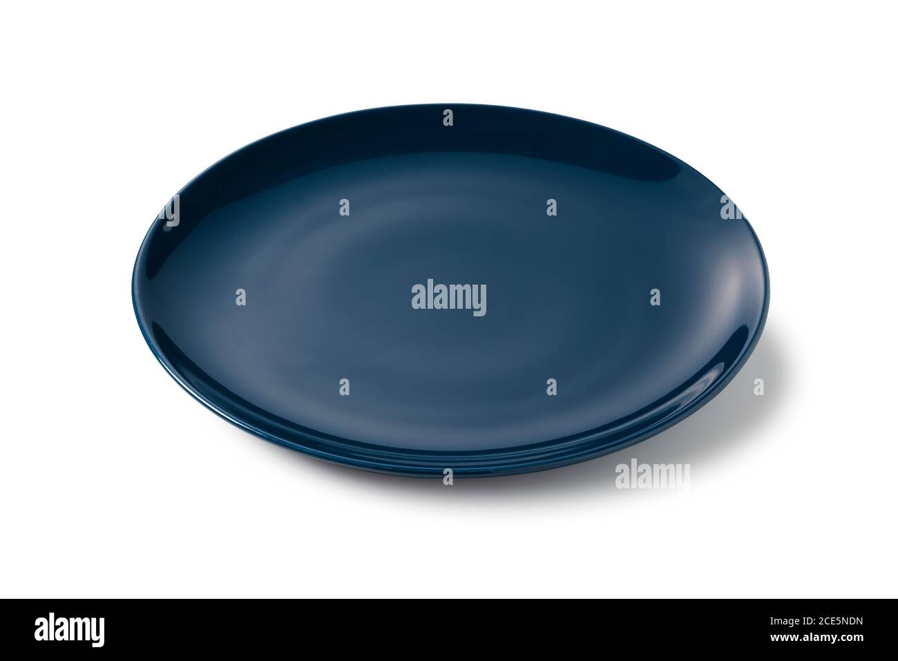Navy blue plate placed on a white background Stock Photo - Alamy