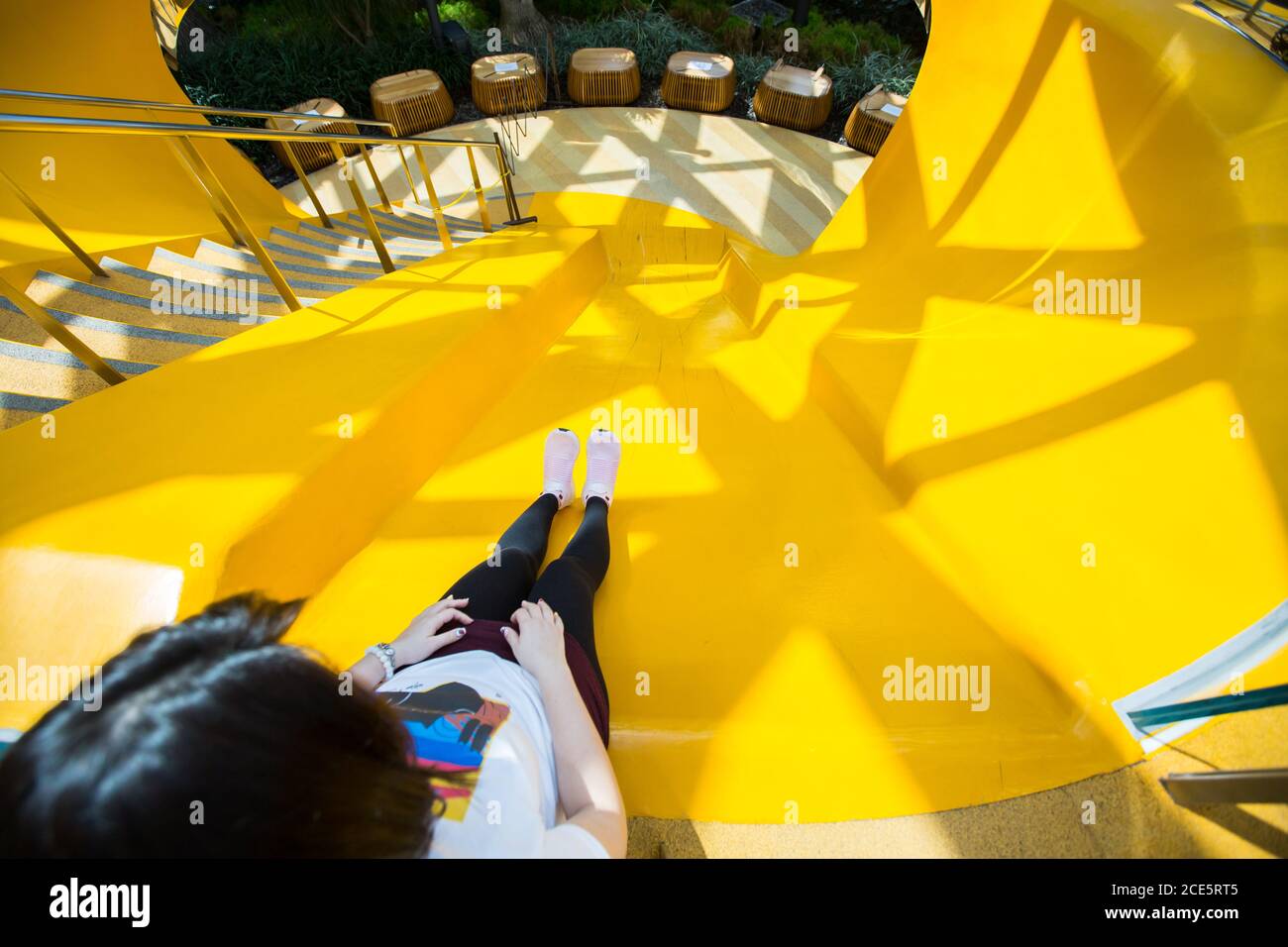 Top down view of a lady getting ready to slide down the super steep ...