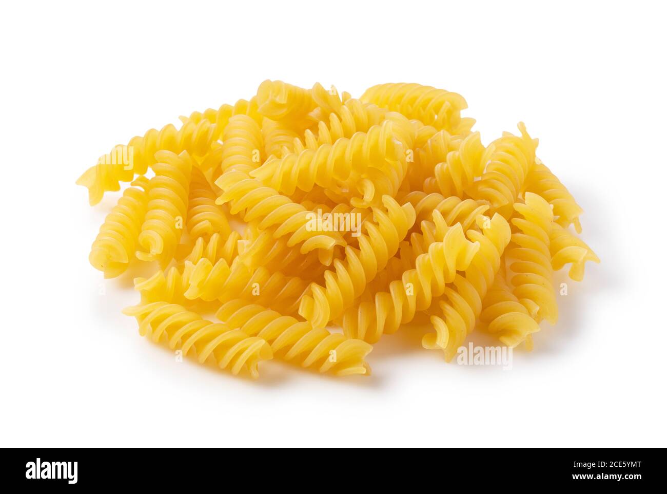 Shooting Fusilli on a white background from an angle Stock Photo - Alamy