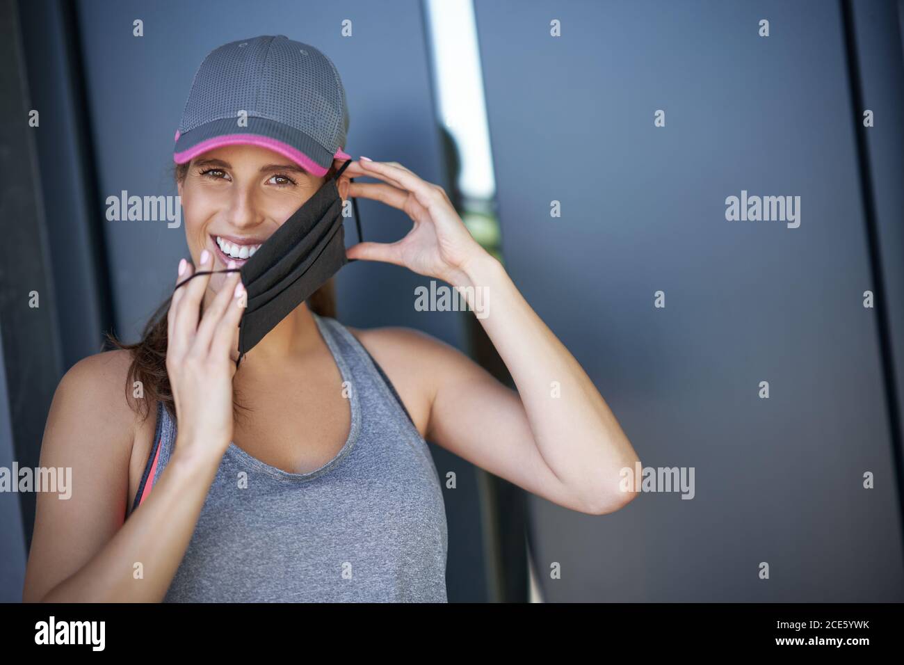 Female runner using protective mask during coronavirus pandemic Stock ...