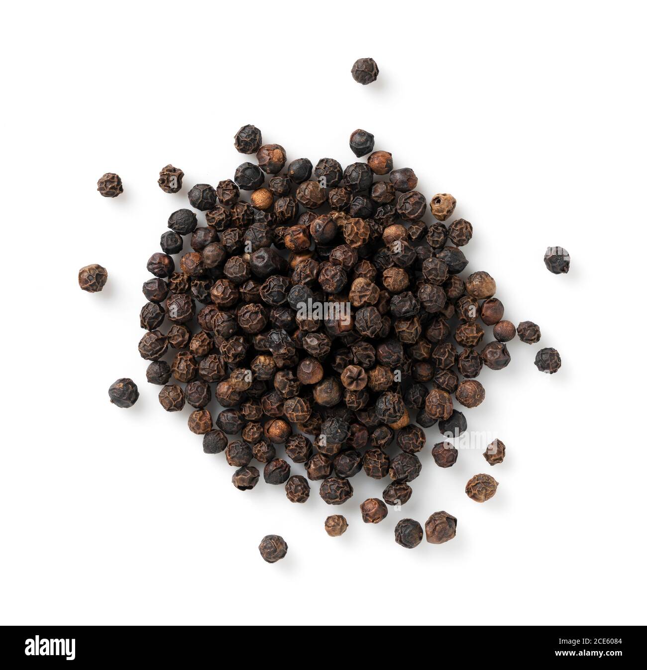 Shot from a bird's-eye view of black pepper placed on a white ...