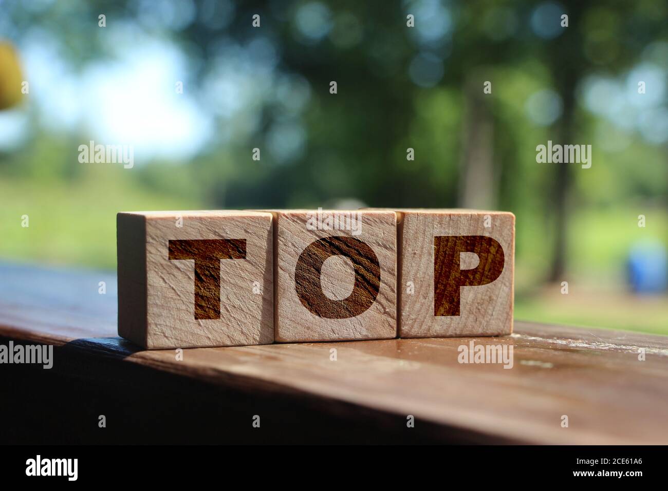 Top word on Wooden cubes arranged in three with copy space and nature ...