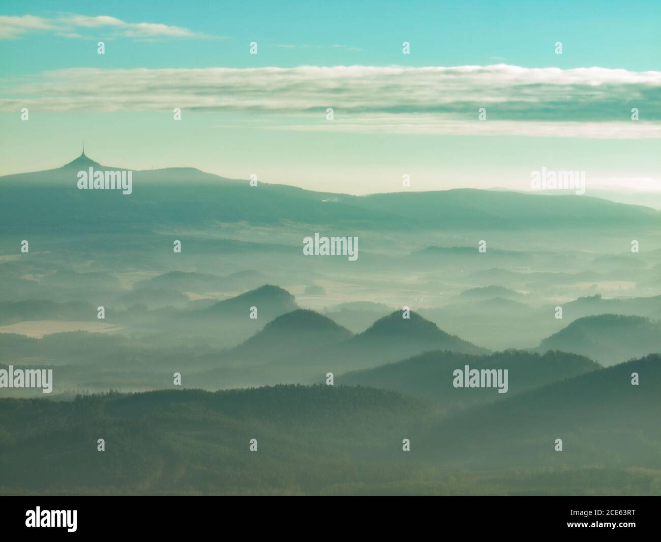 Blue green mist cover landscape, Sun in mist Stock Photo - Alamy