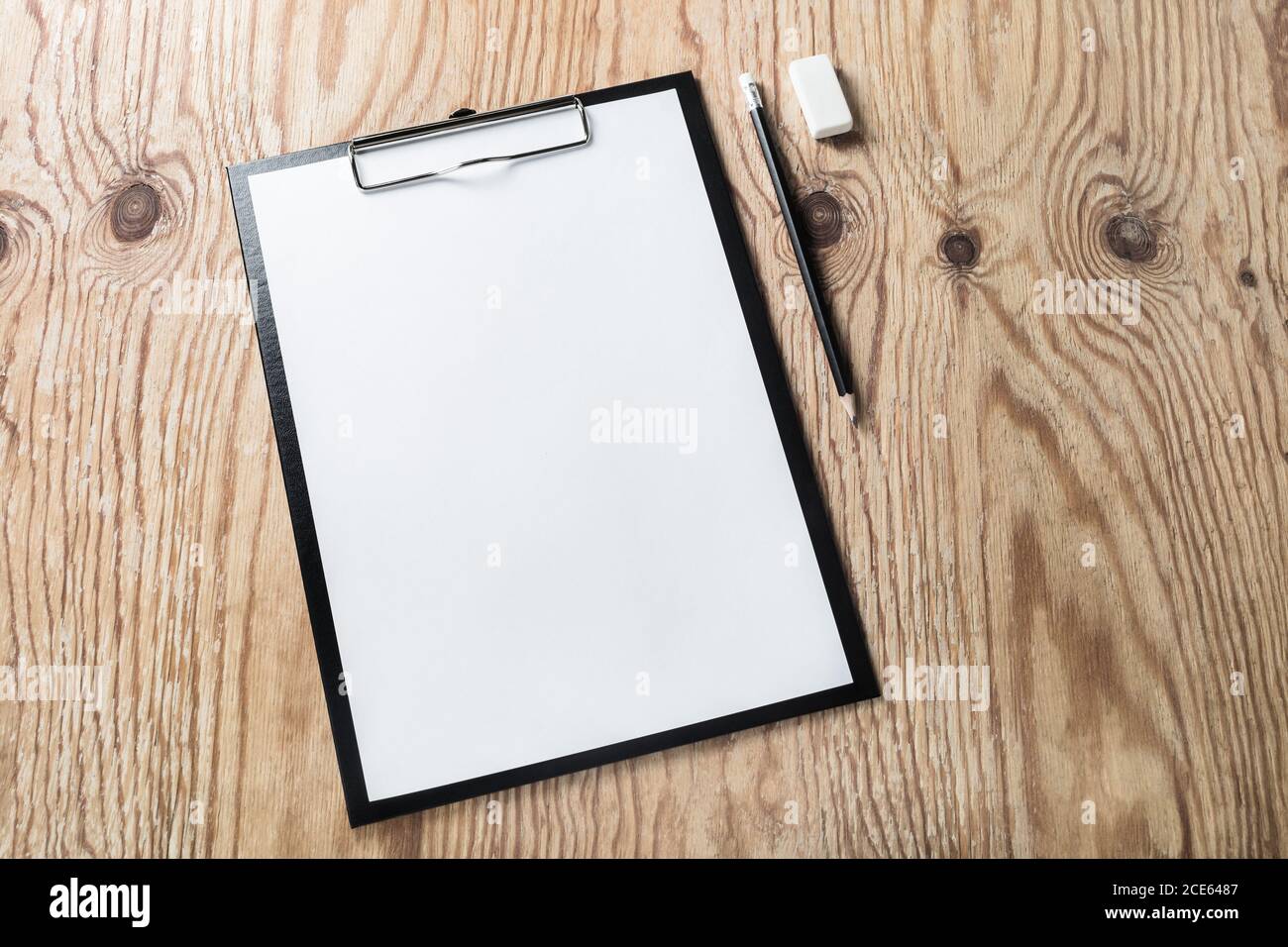 Clipboard, paper, pencil, eraser Stock Photo - Alamy