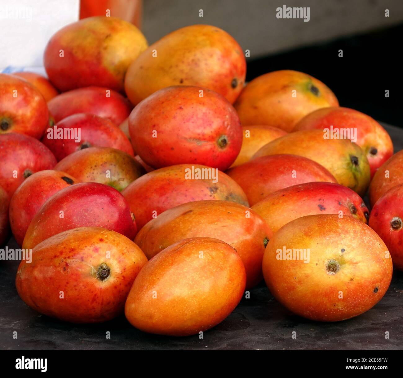 Ripe Red Mangoes for Sale Stock Photo - Alamy