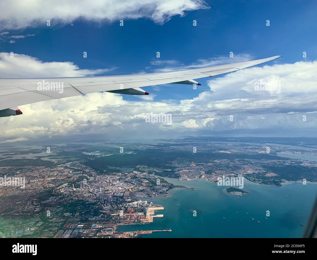 Wing of an airplane flying above the ocean. The view from an airplane ...