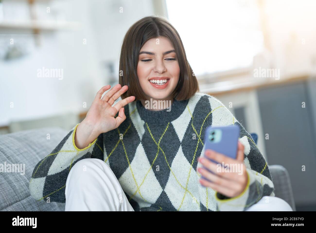 Teenage girl texting at home Stock Photo - Alamy