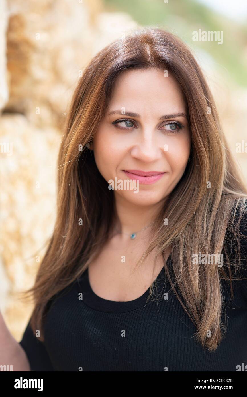 Beautiful woman standing outdooirs Stock Photo - Alamy