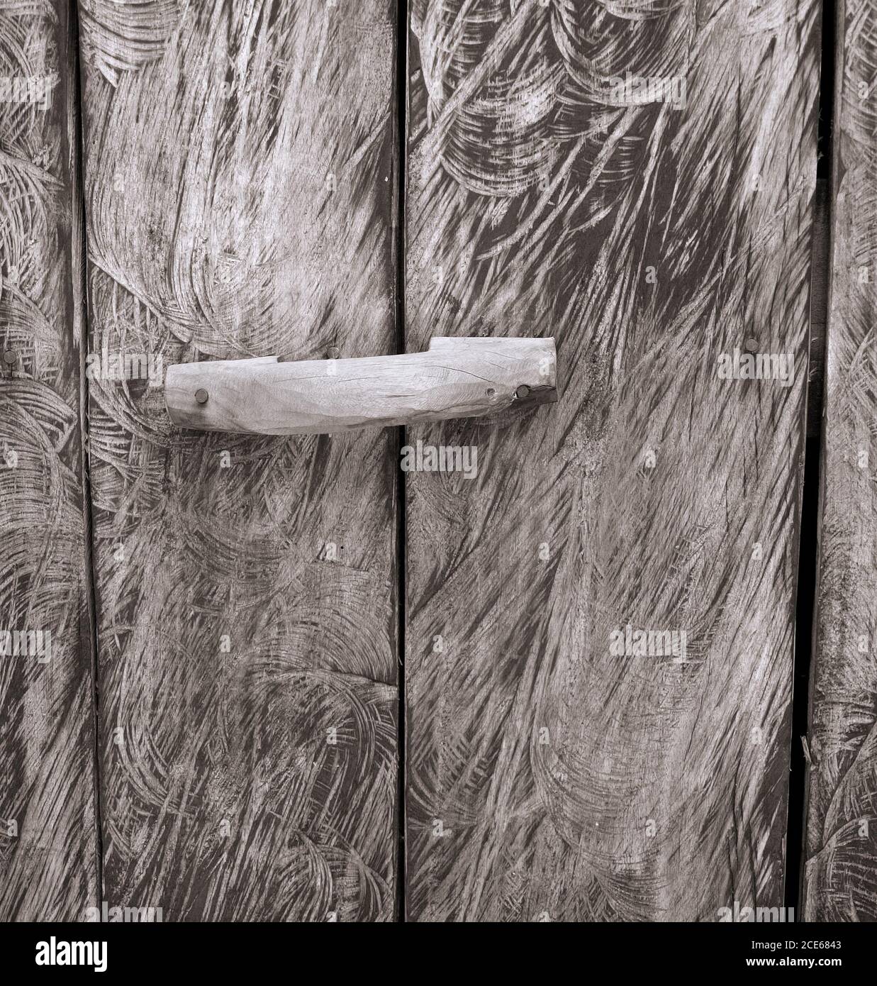 A simple door with a wooden handle as part of a native house Stock ...