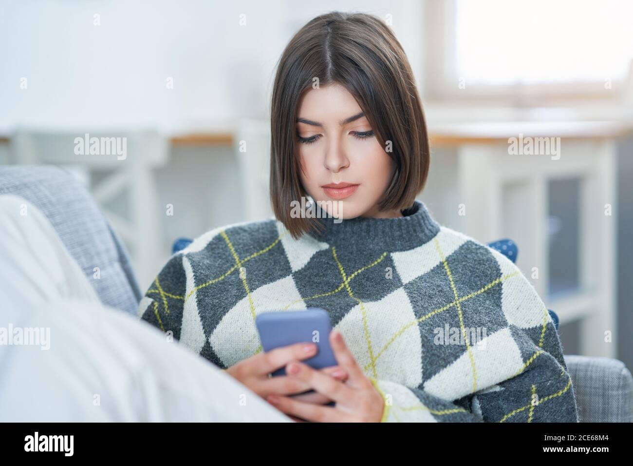 Teenage girl texting at home Stock Photo - Alamy