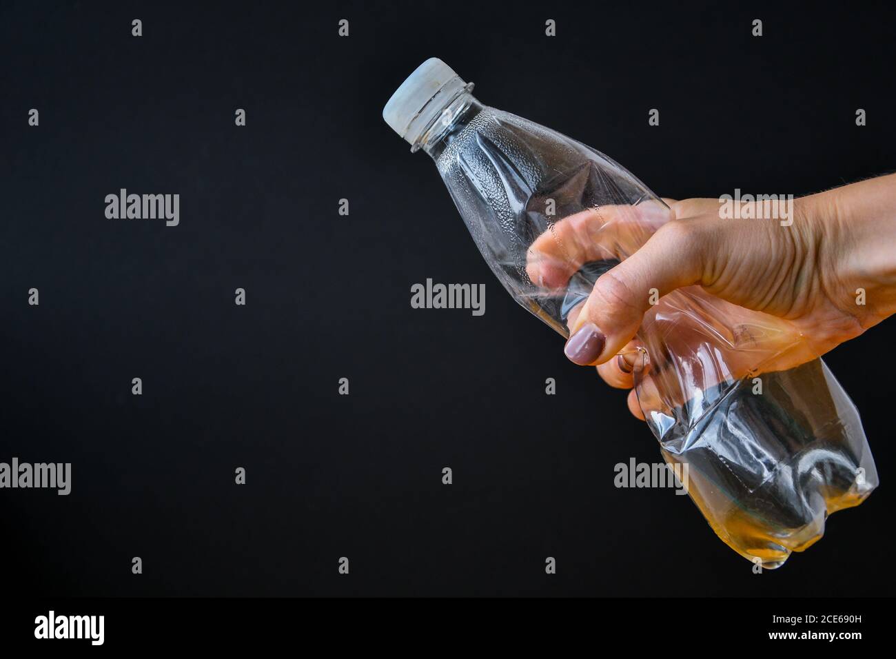 hand hold plastic bottles to discard ,concept global warming ...