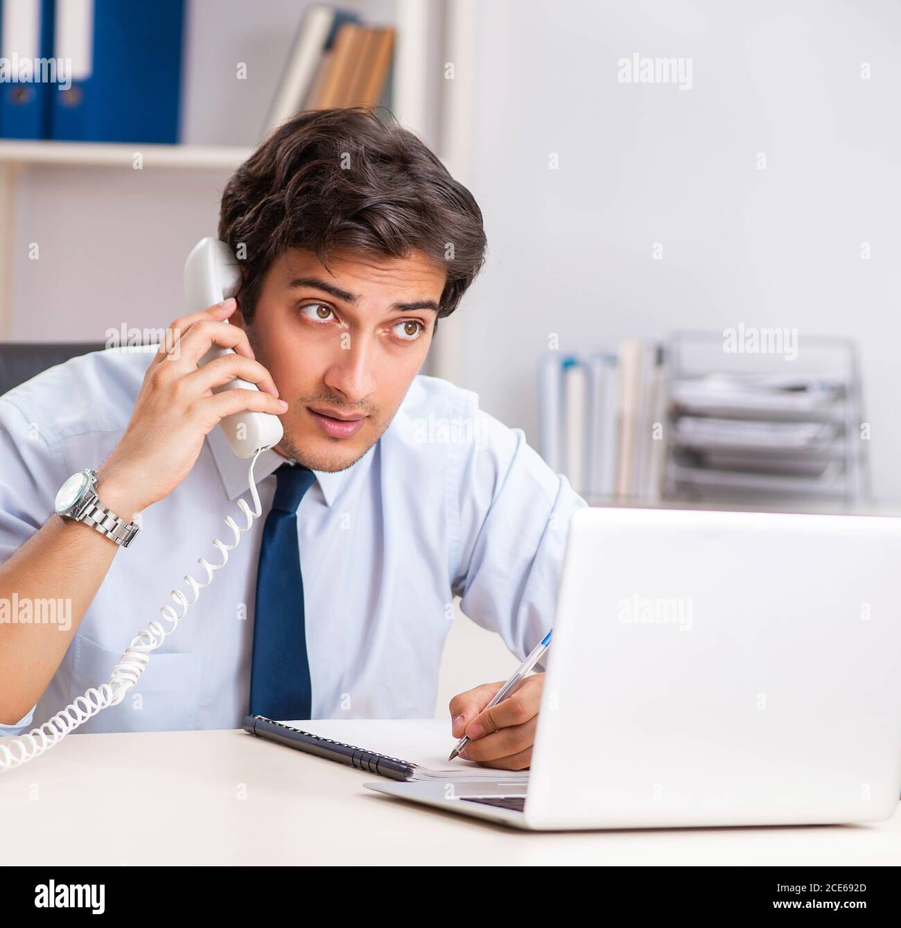 Male receptionist notes hi-res stock photography and images - Alamy