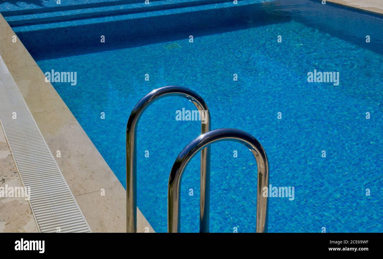 Blue swimming pool in a resort Stock Photo - Alamy