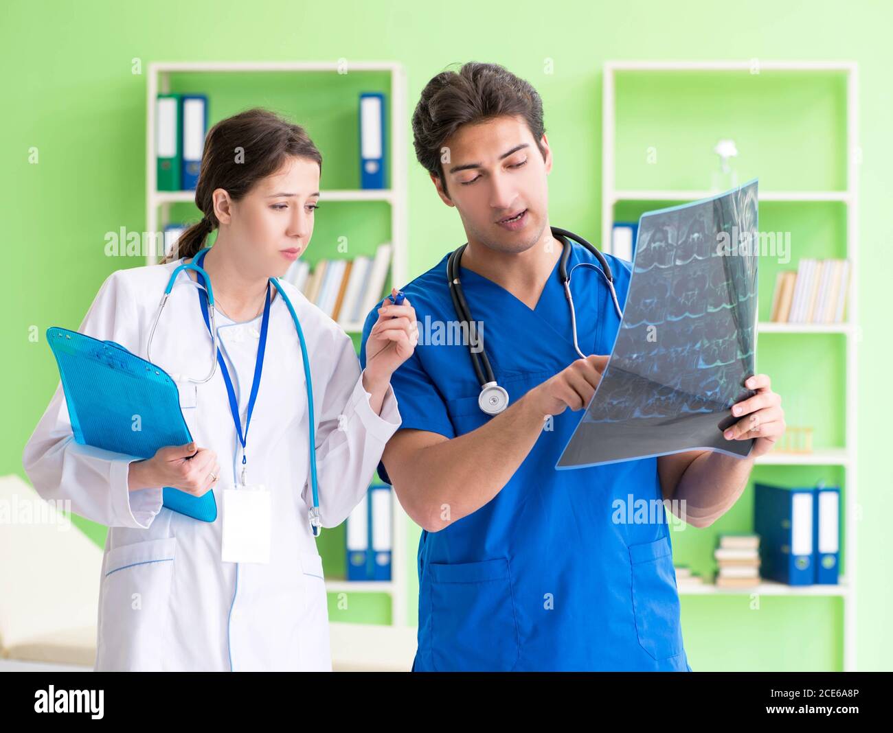 Woman and man gynecologists discussing medical case at the clinic Stock ...
