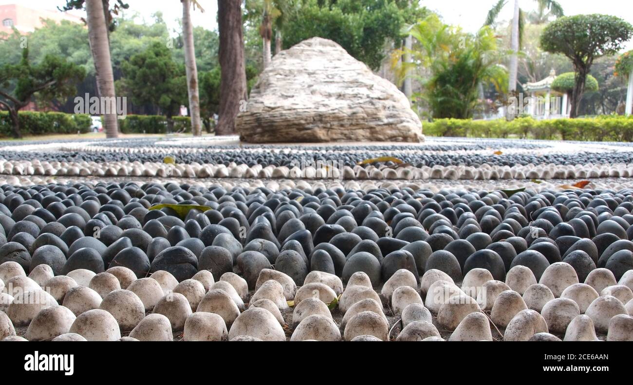 Chinese health walk made up from large pebbles in different colors ...