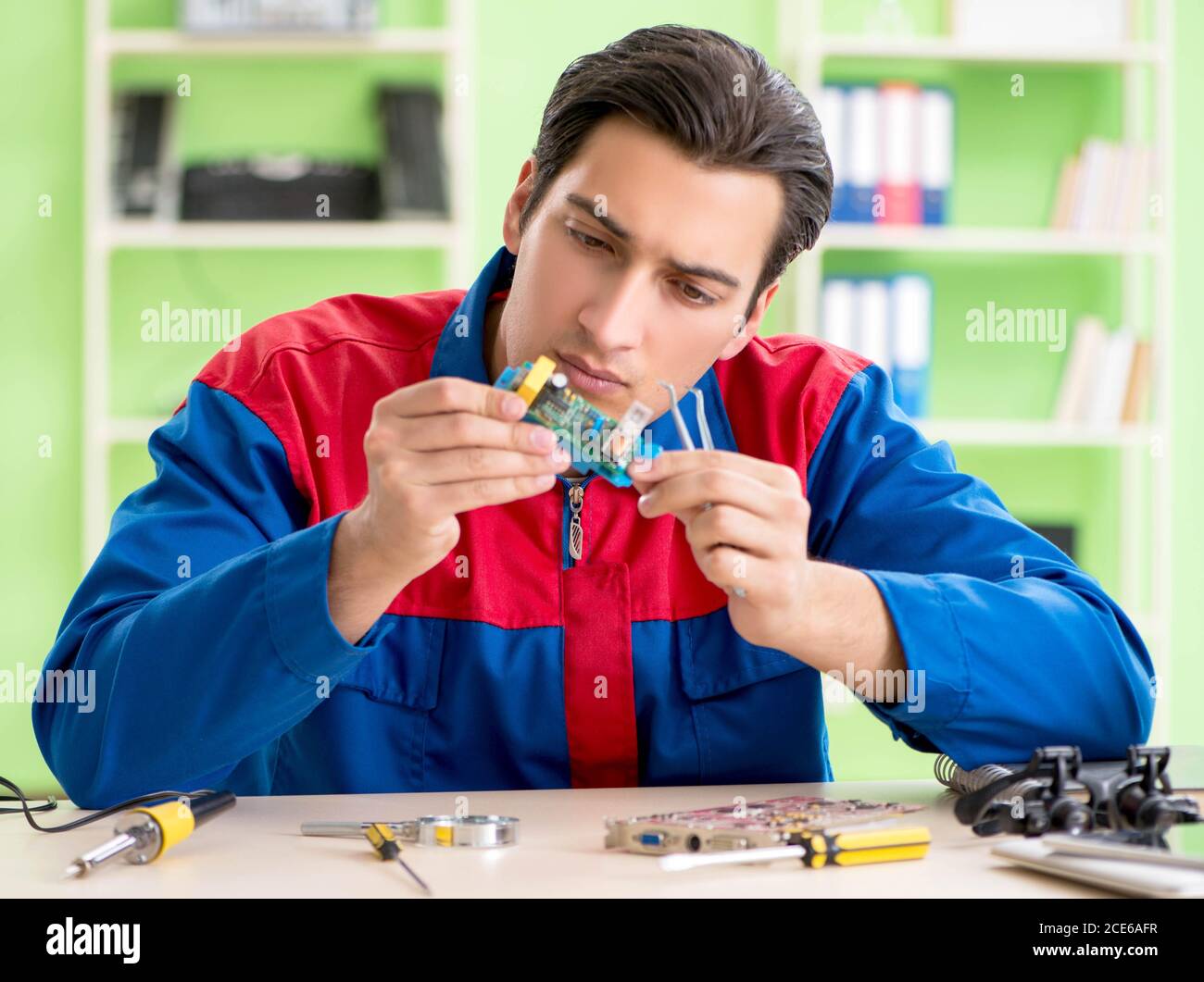 The computer engineer repairing broken desktop Stock Photo - Alamy
