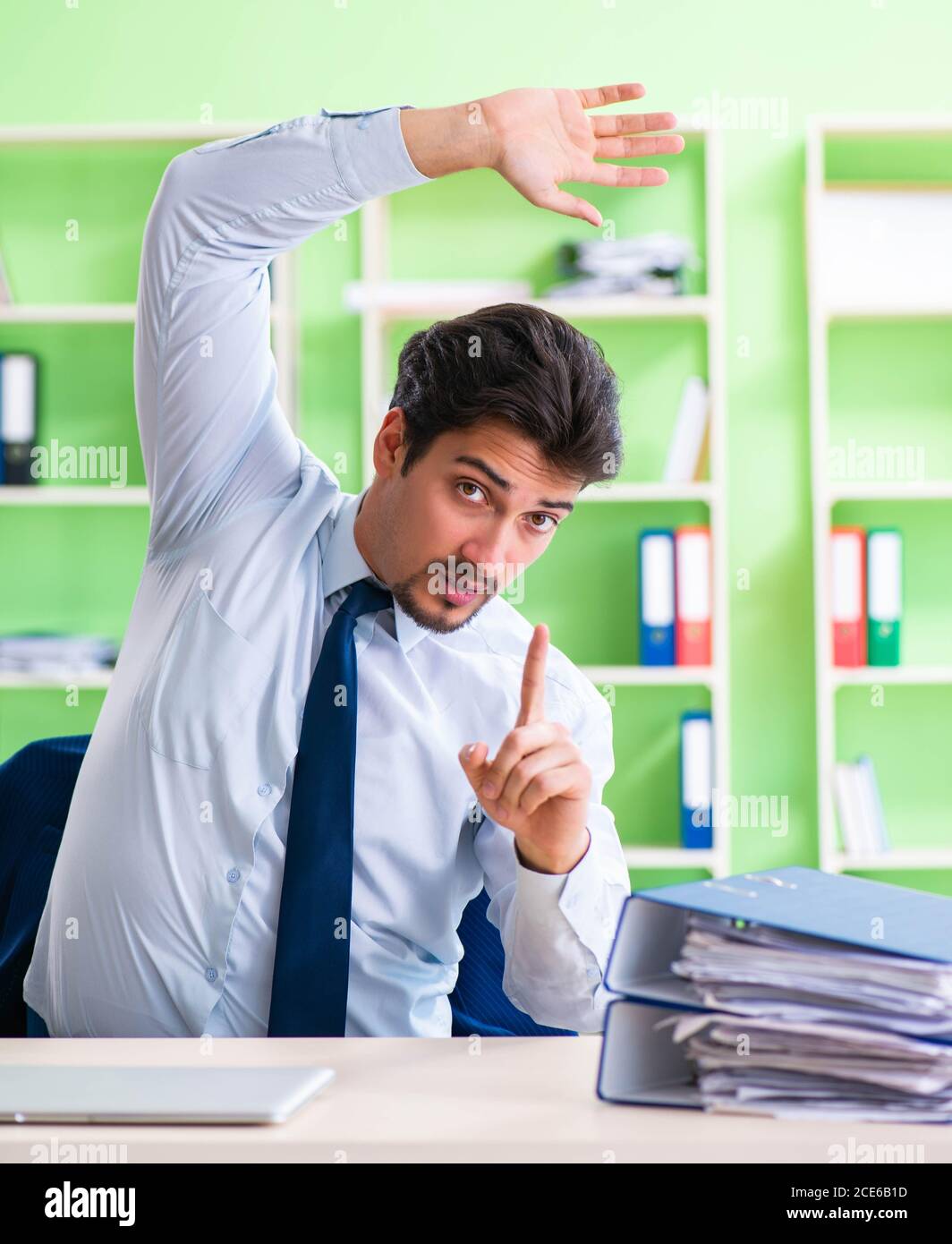The employee doing exercises during break at work Stock Photo - Alamy